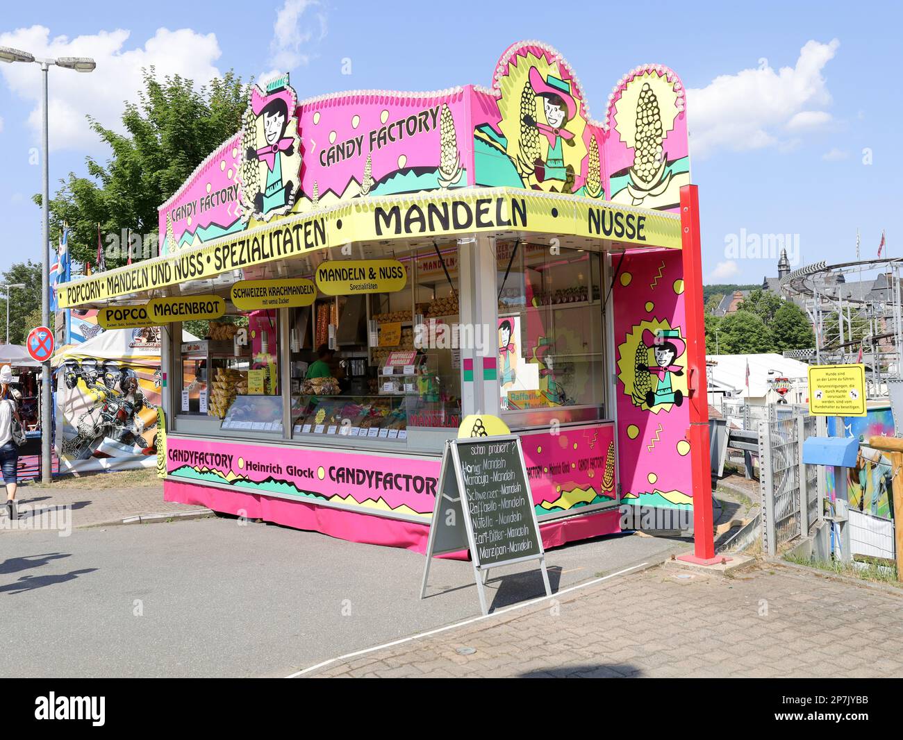 colorful booths and fun rides at a fairground Stock Photo - Alamy