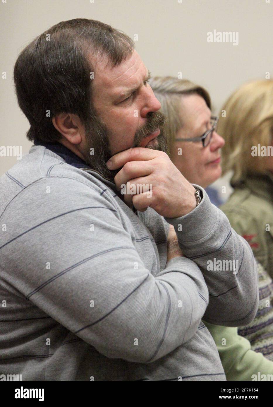 Mark Becker's father, Dave and mother, Joan listen to instructions that ...