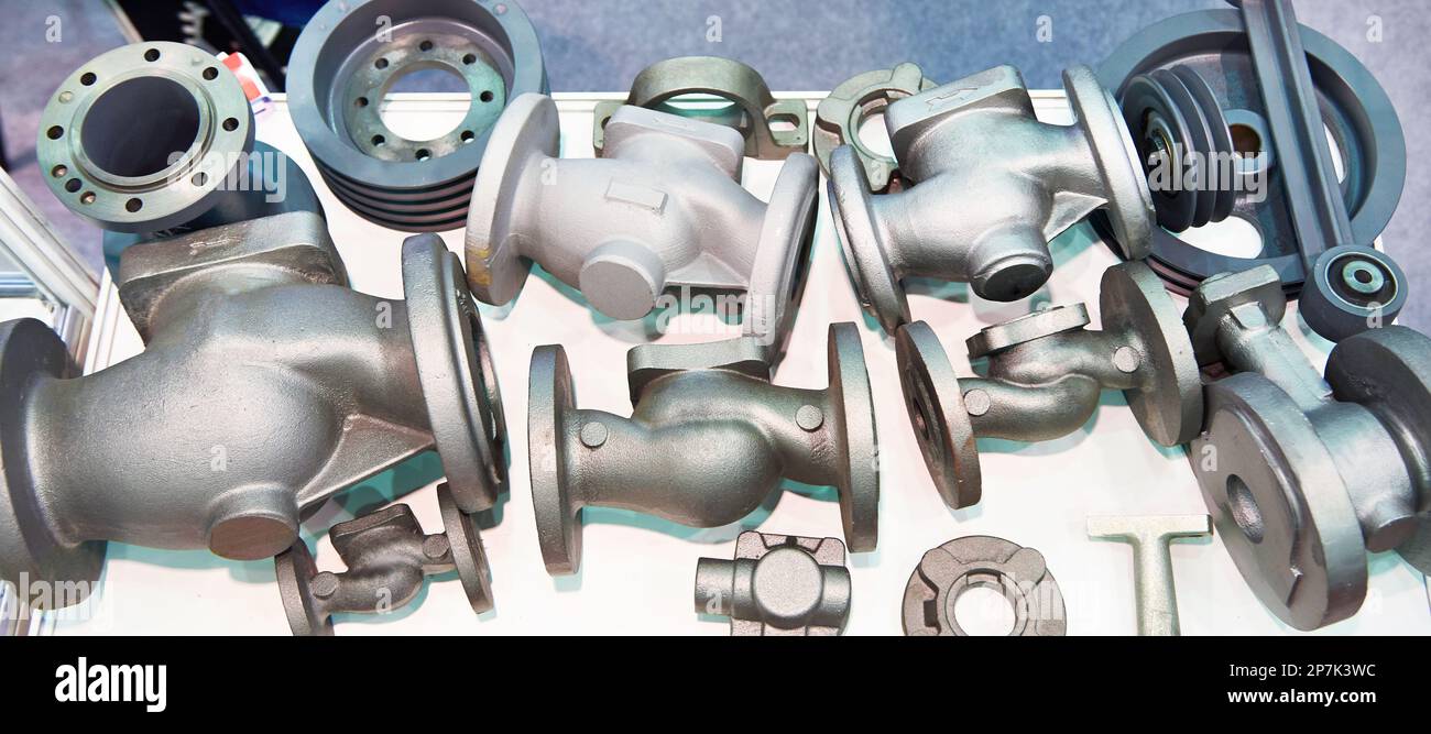 Cast iron parts for industrial valves in store Stock Photo - Alamy