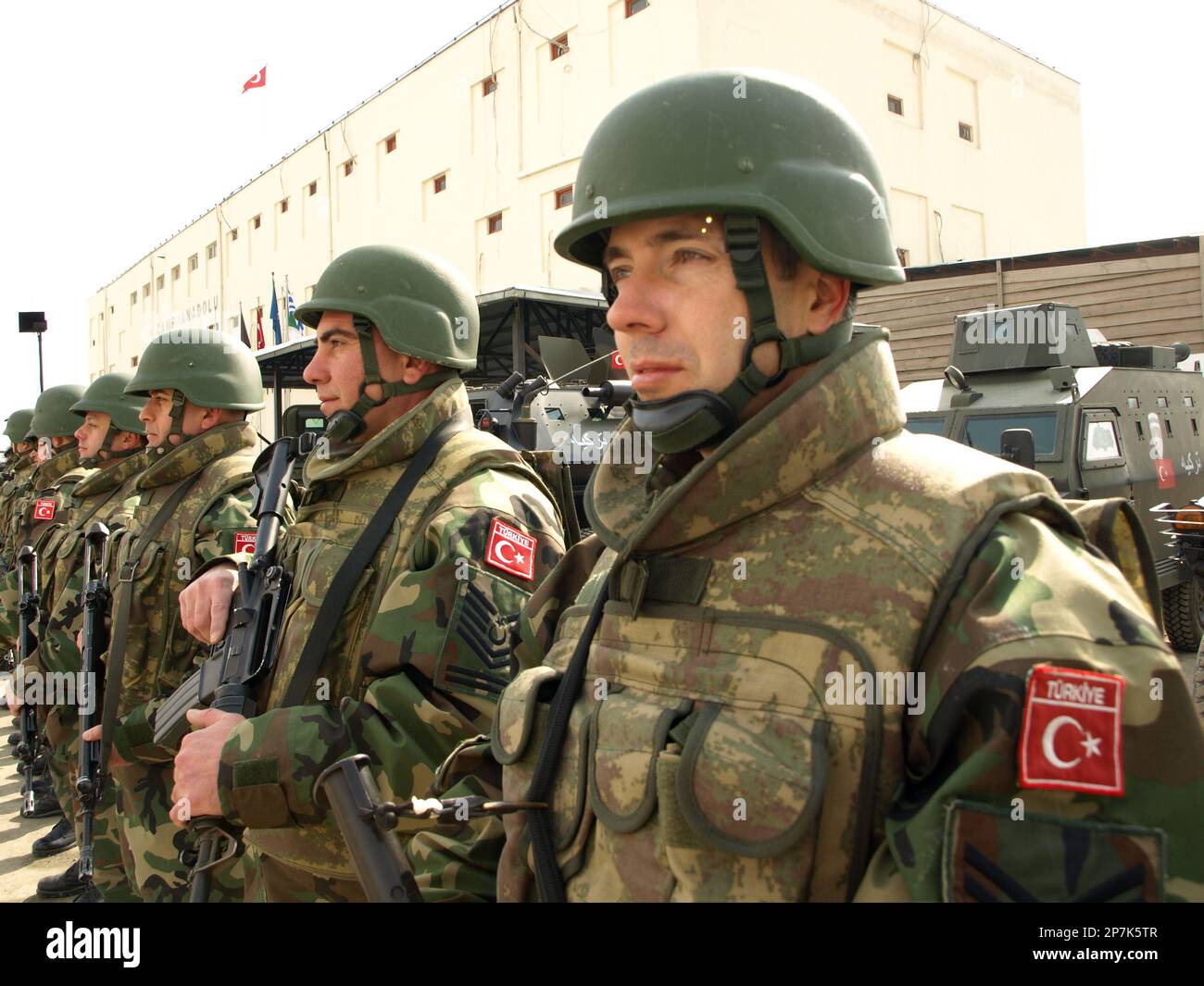 Turkish soldiers in combat gear stand guard outside the headquarters of ...