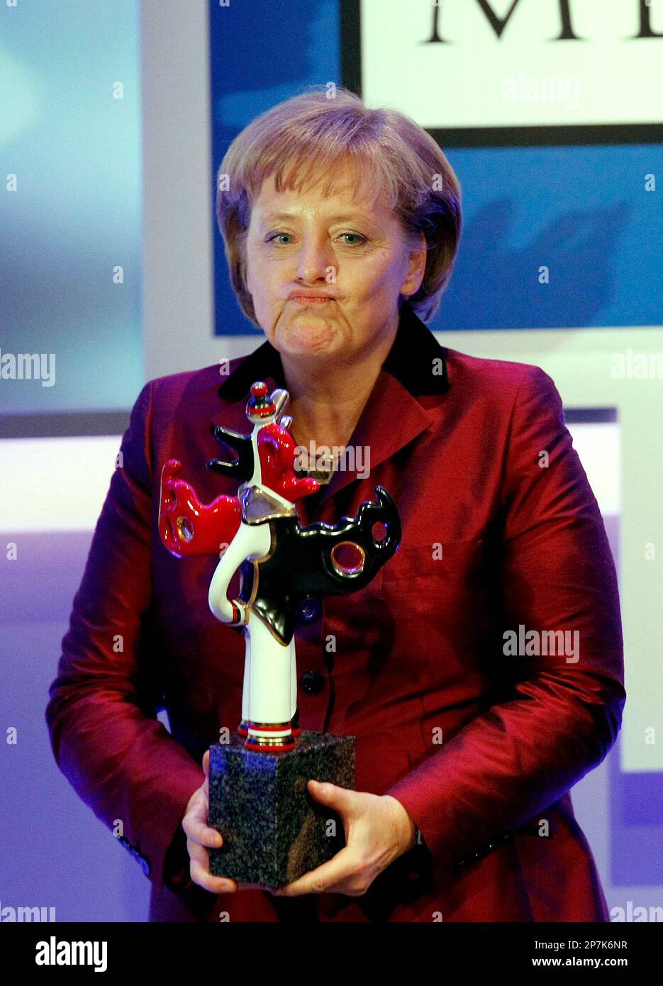 ALTERNATE CROP - German Chancellor Angela Merkel grimaces after ...