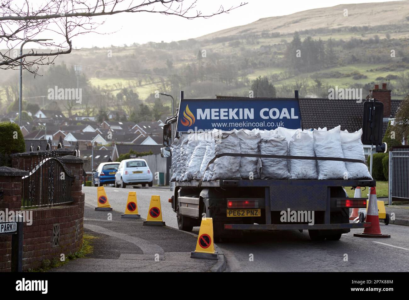 Coal lorry delivering coal to 1980s housing estate in Newtownabbey on ...