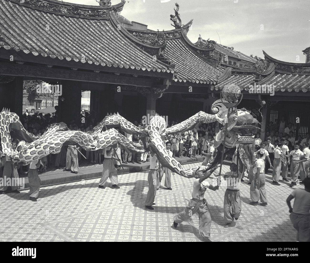 Dragon dance at Telok Ayer Temple on 24 May, 1953. A Coronation dragon ...