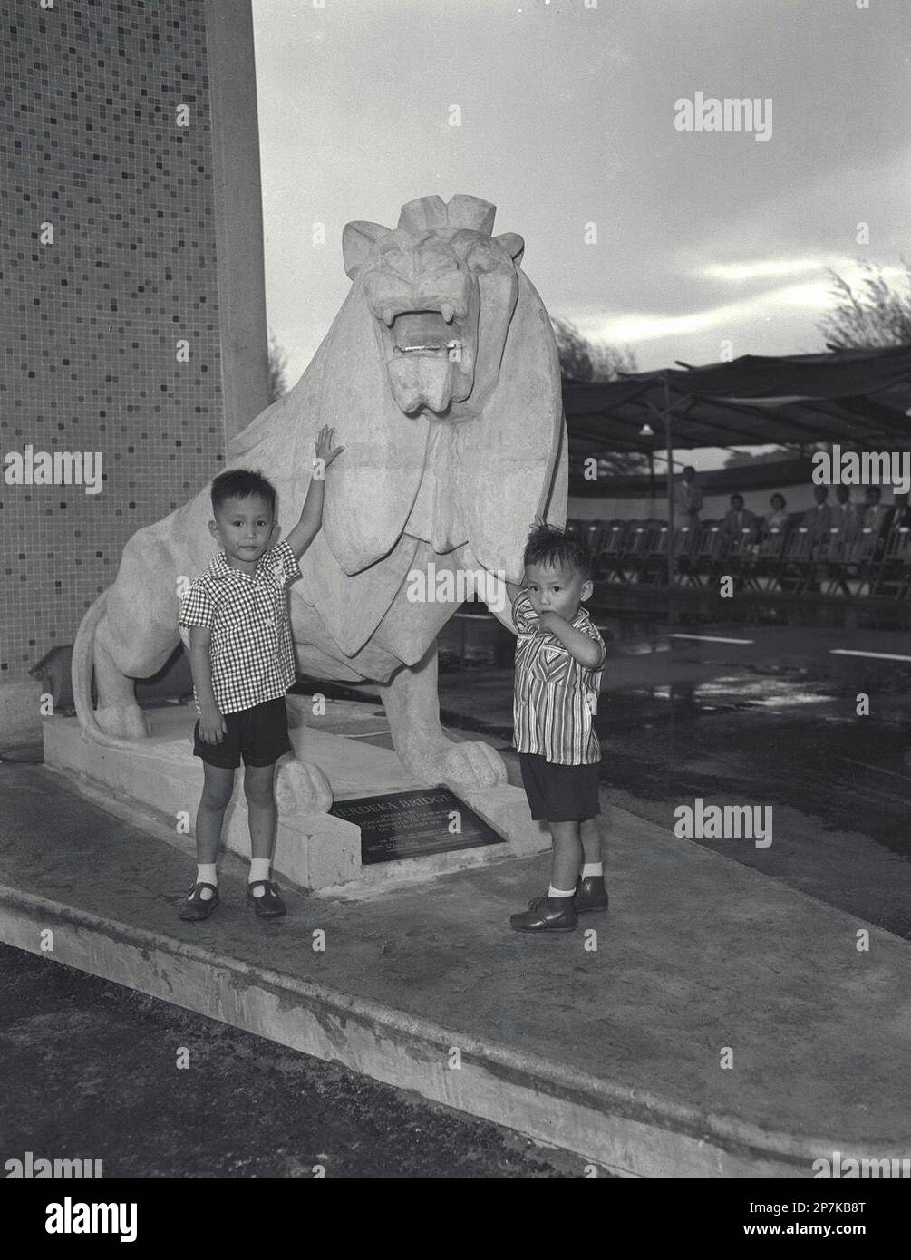 Opening of the New Merdeka Bridge. Two little boys pose for the camera ...
