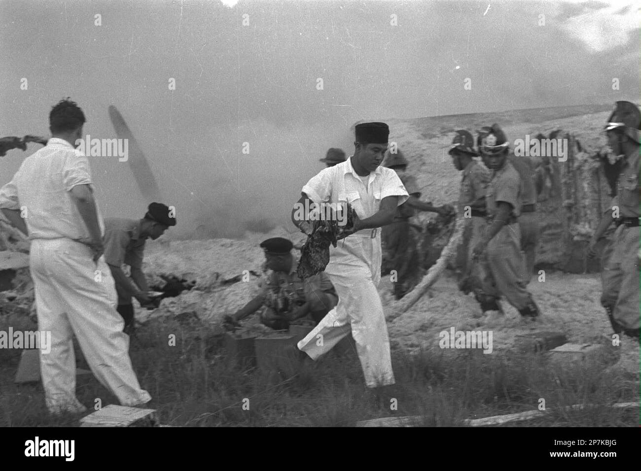 Rescue workers carrying victims from the shattered remains of the ...