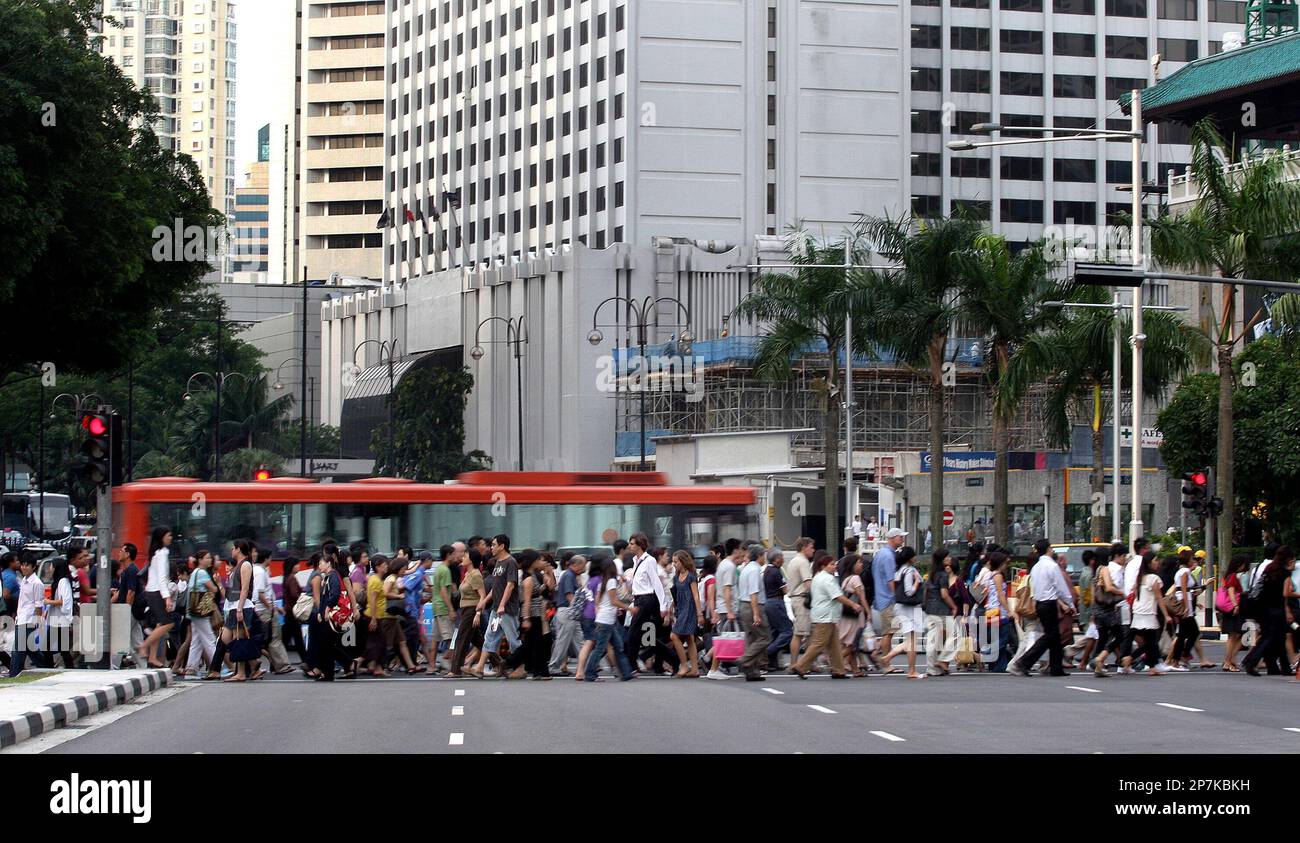 Pedestrians crossing at junction of Scotts Road and Paterson Road along ...