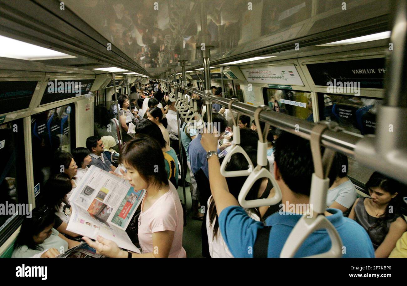 Morning peak hour crowd in the MRT at Toa Payoh station at 8am ...
