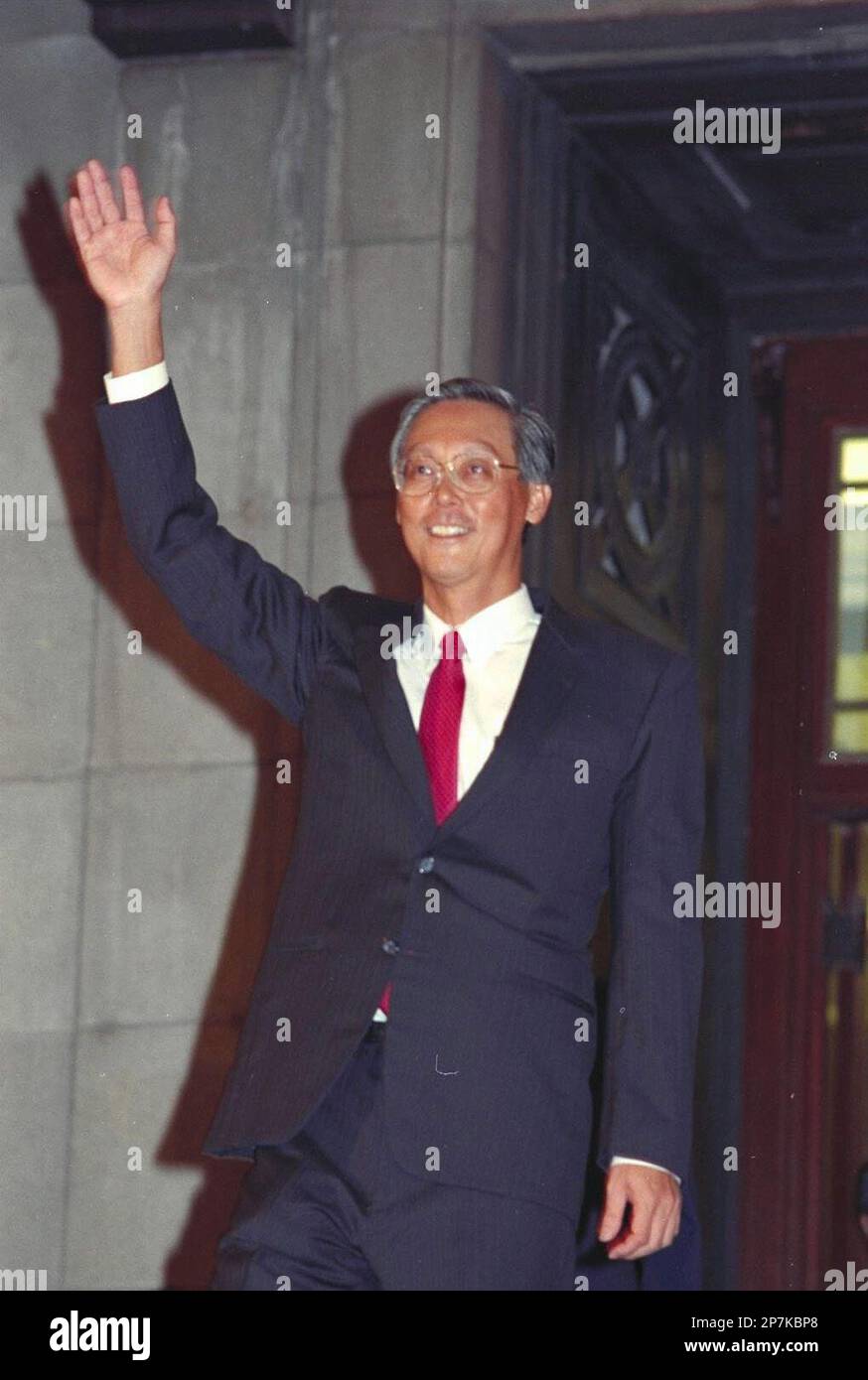 Prime Minister Goh Chok Tong waving to the crowd at Padang after he was ...