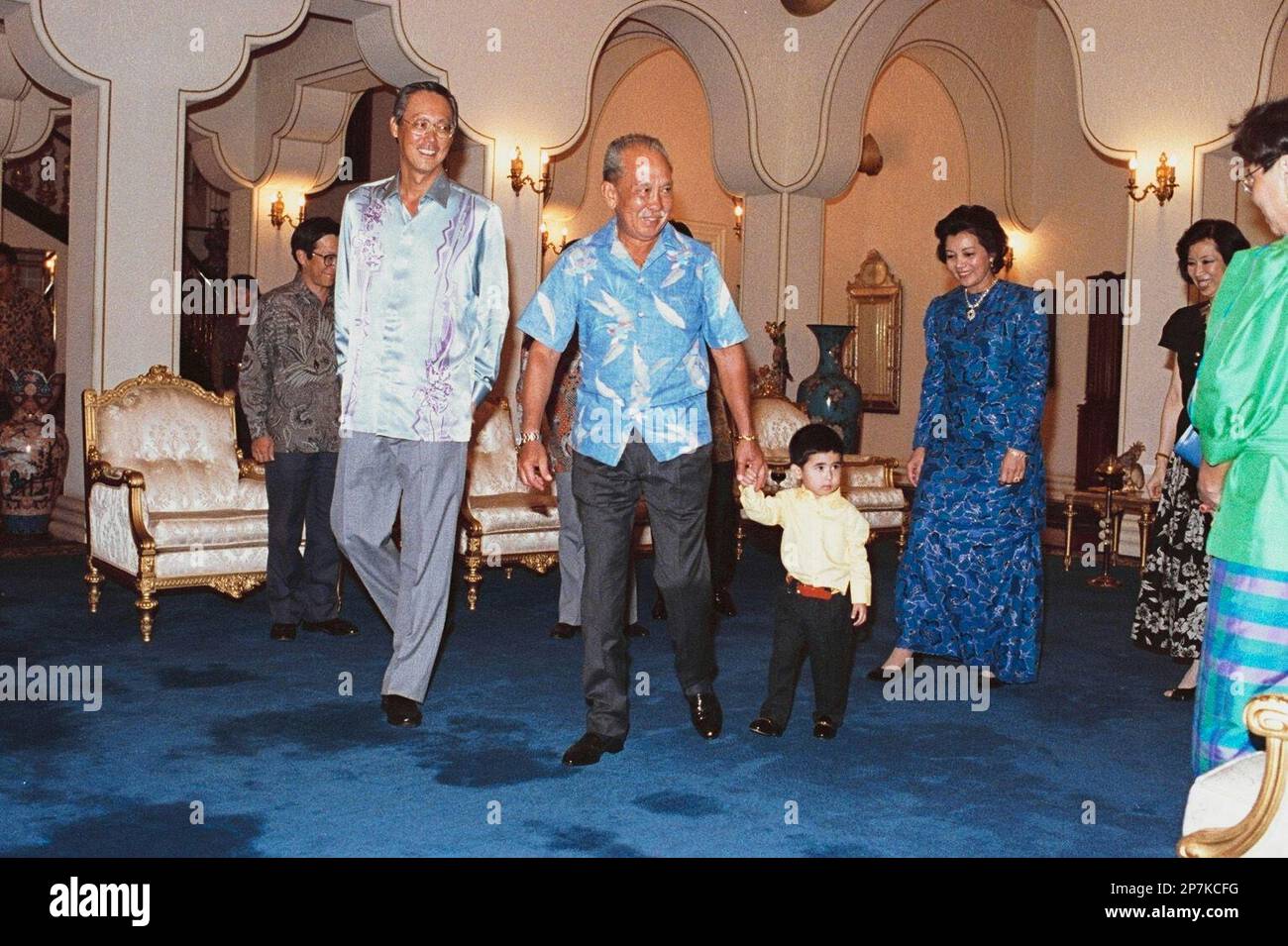 Johor's Sultan Iskandar and his wife Zanariah showing Singapore's Prime ...