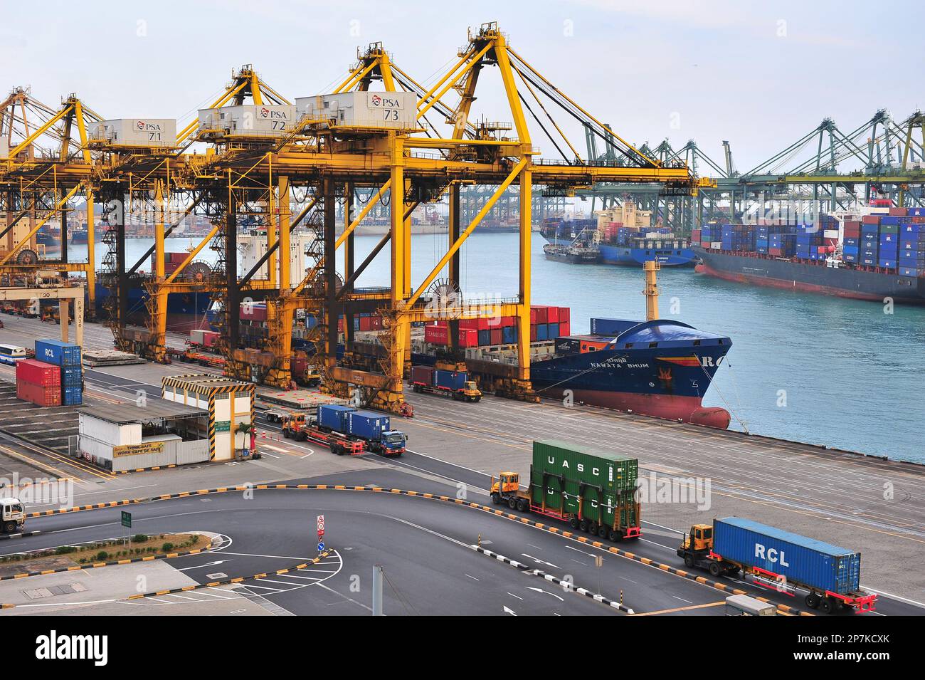 The Keppel and Brani container ports, with cranes loading and unloading ...