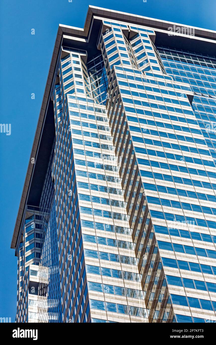 Stone and glass curtain walls and columns emphasize the vertical at 60 ...