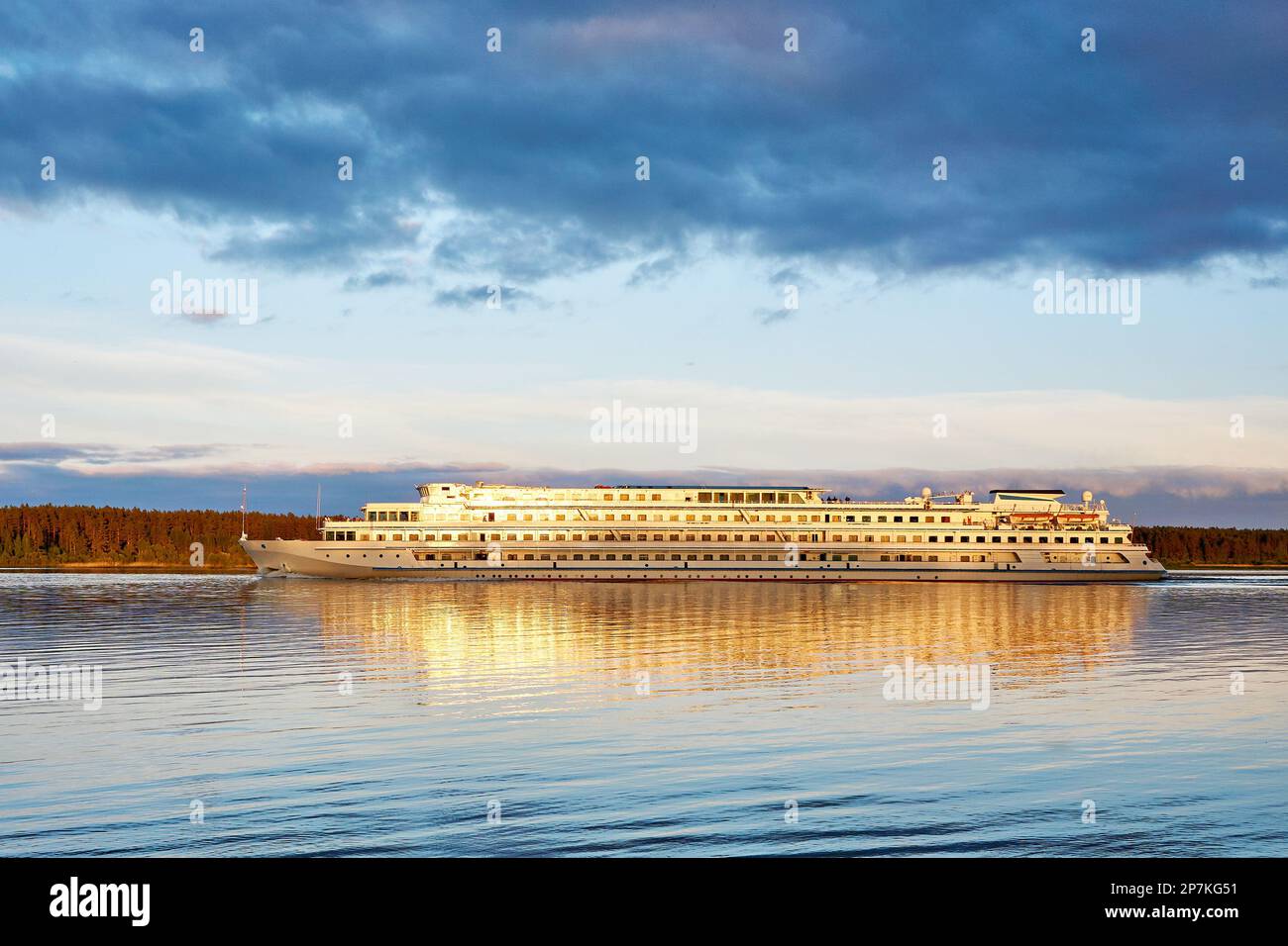 Cruise ship on the river at sunset Stock Photo - Alamy