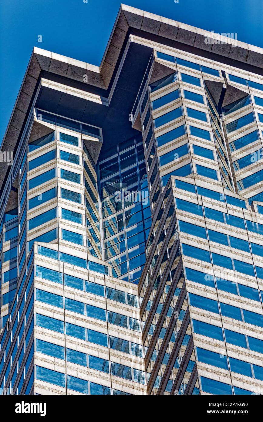 Stone and glass curtain walls and columns emphasize the vertical at 60 ...