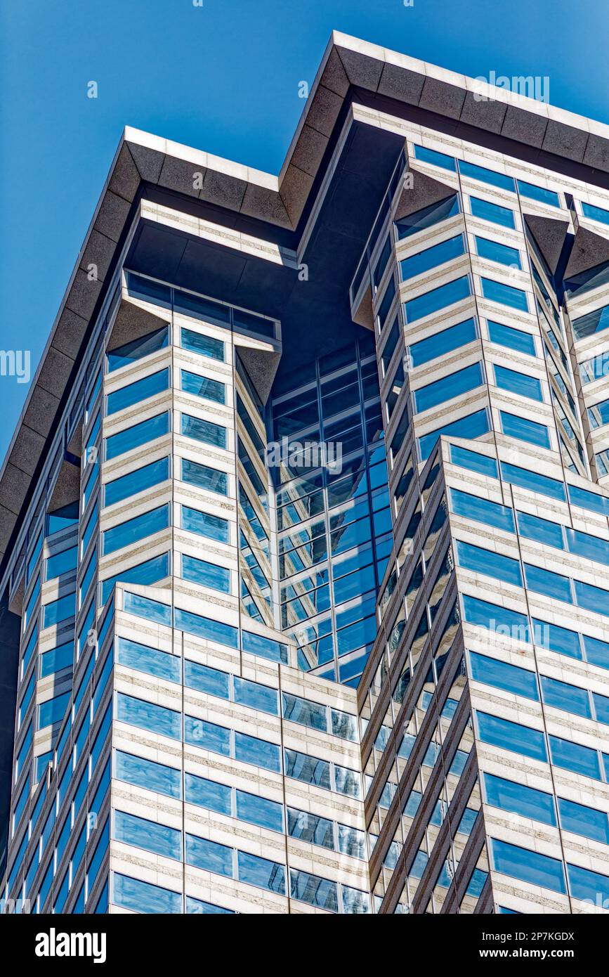 Stone and glass curtain walls and columns emphasize the vertical at 60 ...