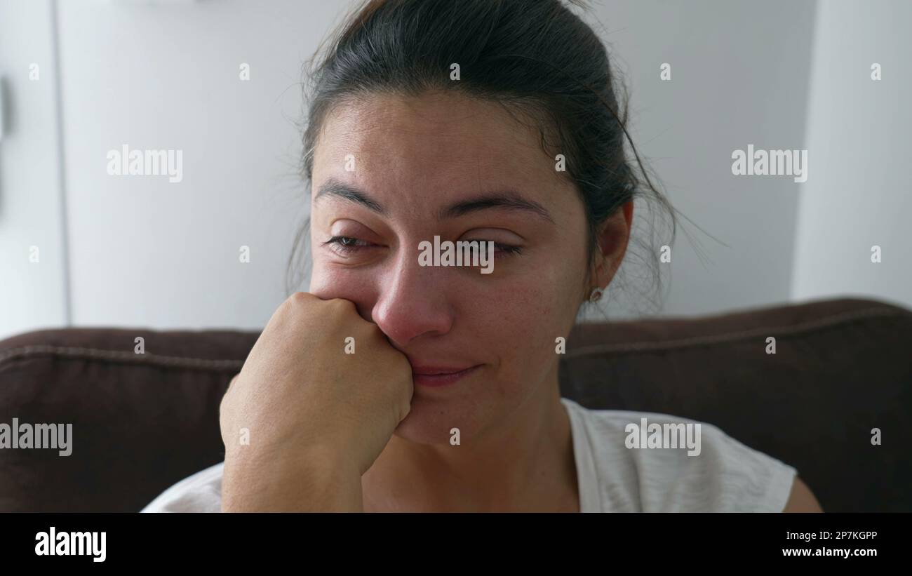 Sad woman taking a deep breath feeling anxious. Crying female person ...