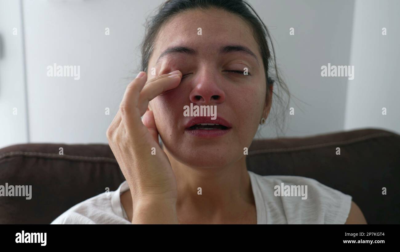 Sad woman taking a deep breath feeling anxious. Crying female person ...