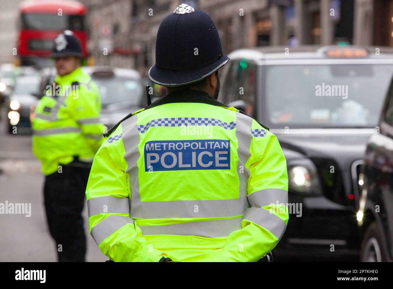 London, UK, 4 March 2023: Metropolitan Police officers in yellow-green ...