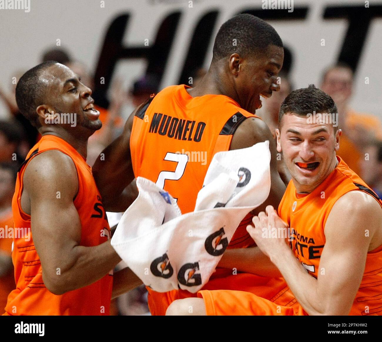 Oklahoma State's Obi Muonelo, center, celebrates with teammates James ...