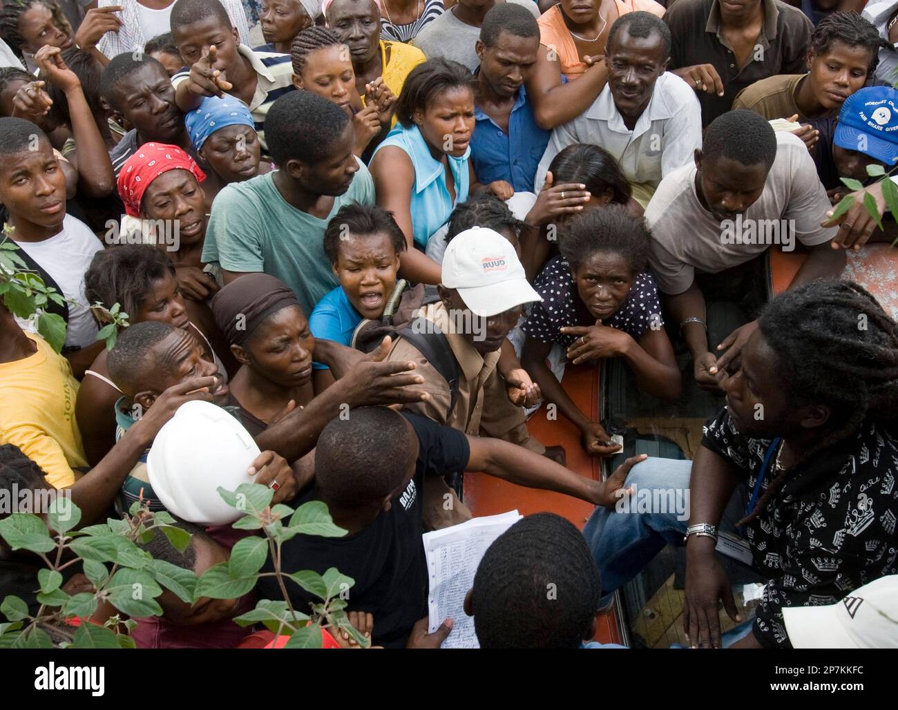 People crowd a food distribution truck Monday, Jan. 25, 2010 in Port-Au ...