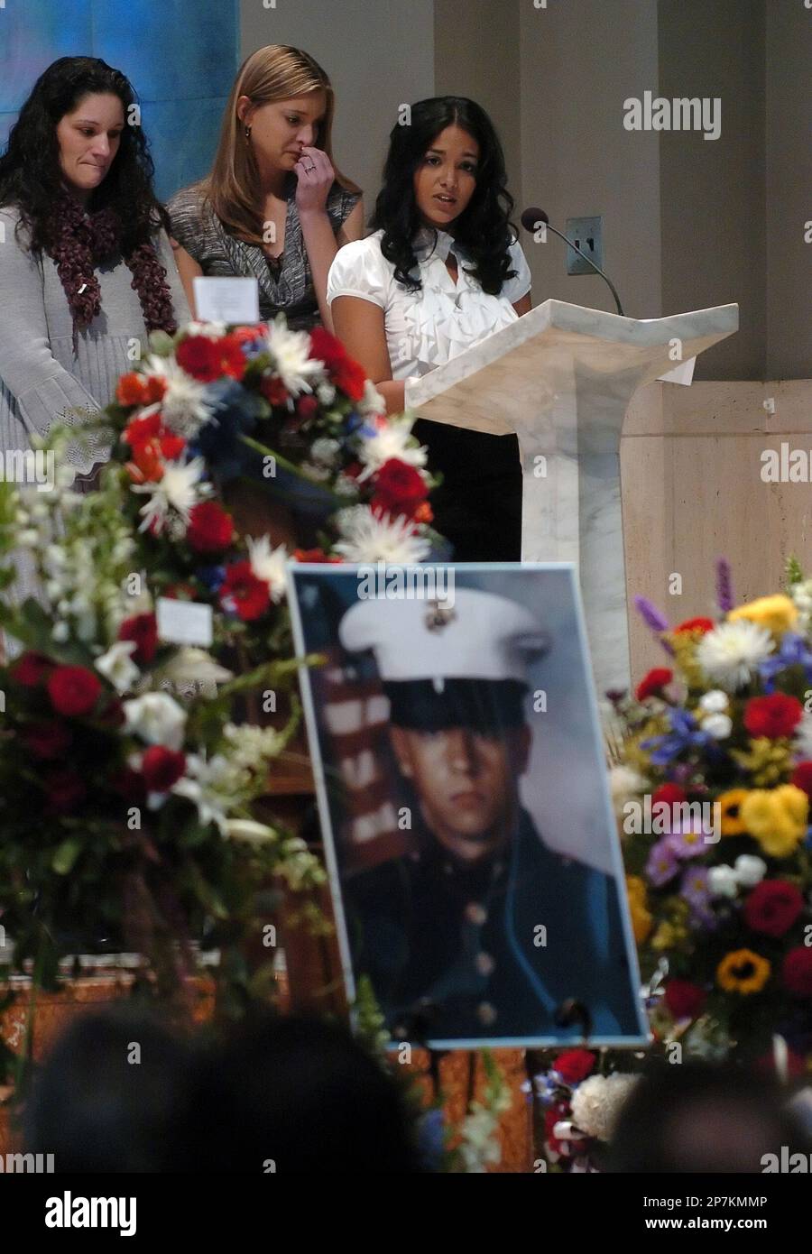 Yasmin Ingham, right, speaks at the memorial service for her husband ...