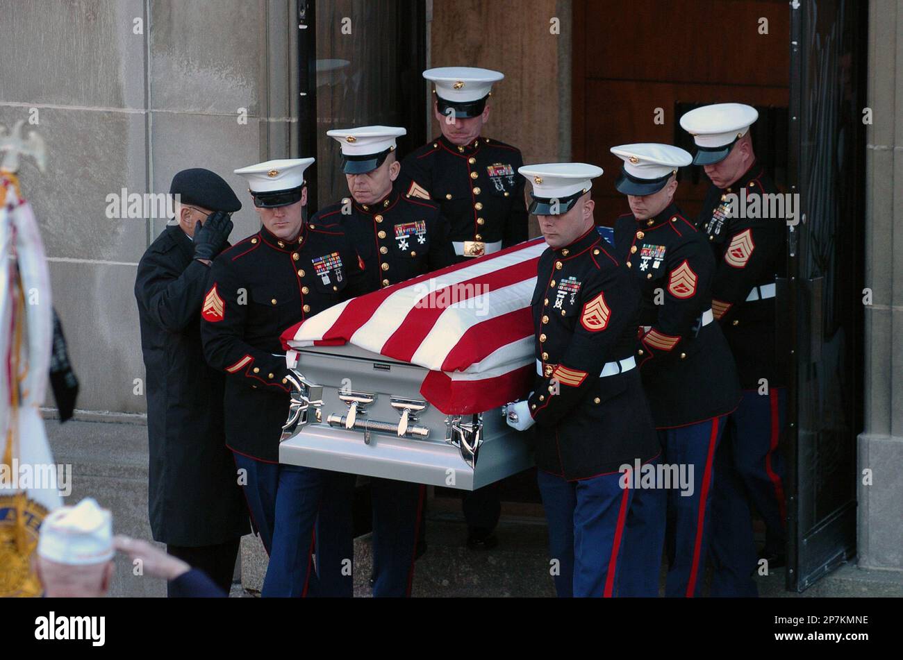 A Marinehonor guard carries the coffin of Marine Staff Sgt. Matt Ingham ...