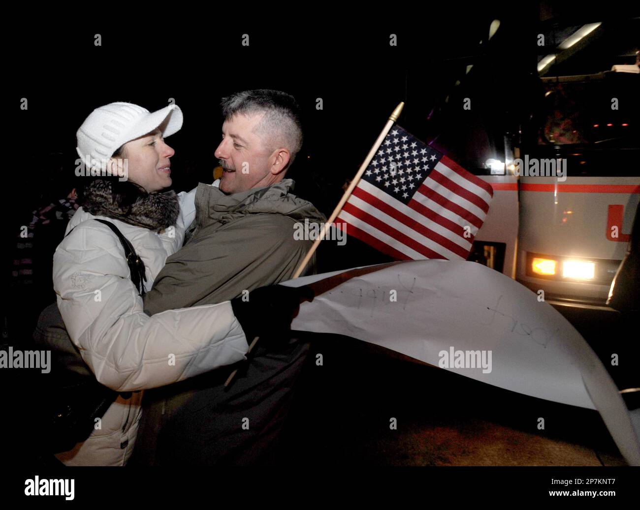 Sgt. Robert Kipp, right, of Racine, Wis., hugs his wife, Marina ...