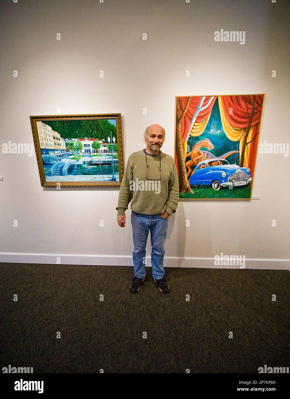 In this Jan. 12, 2010 photo, artist Dan DeRoux stands between two of ...