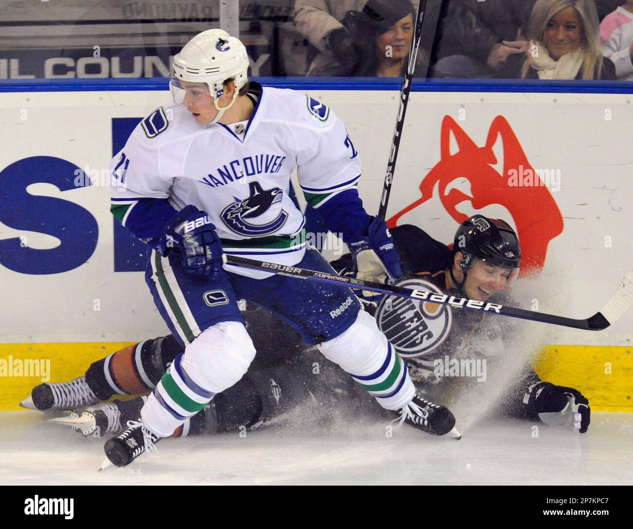 Edmonton Oilers' Lubomir Visnovsky, right, of Slovakia, collides with ...