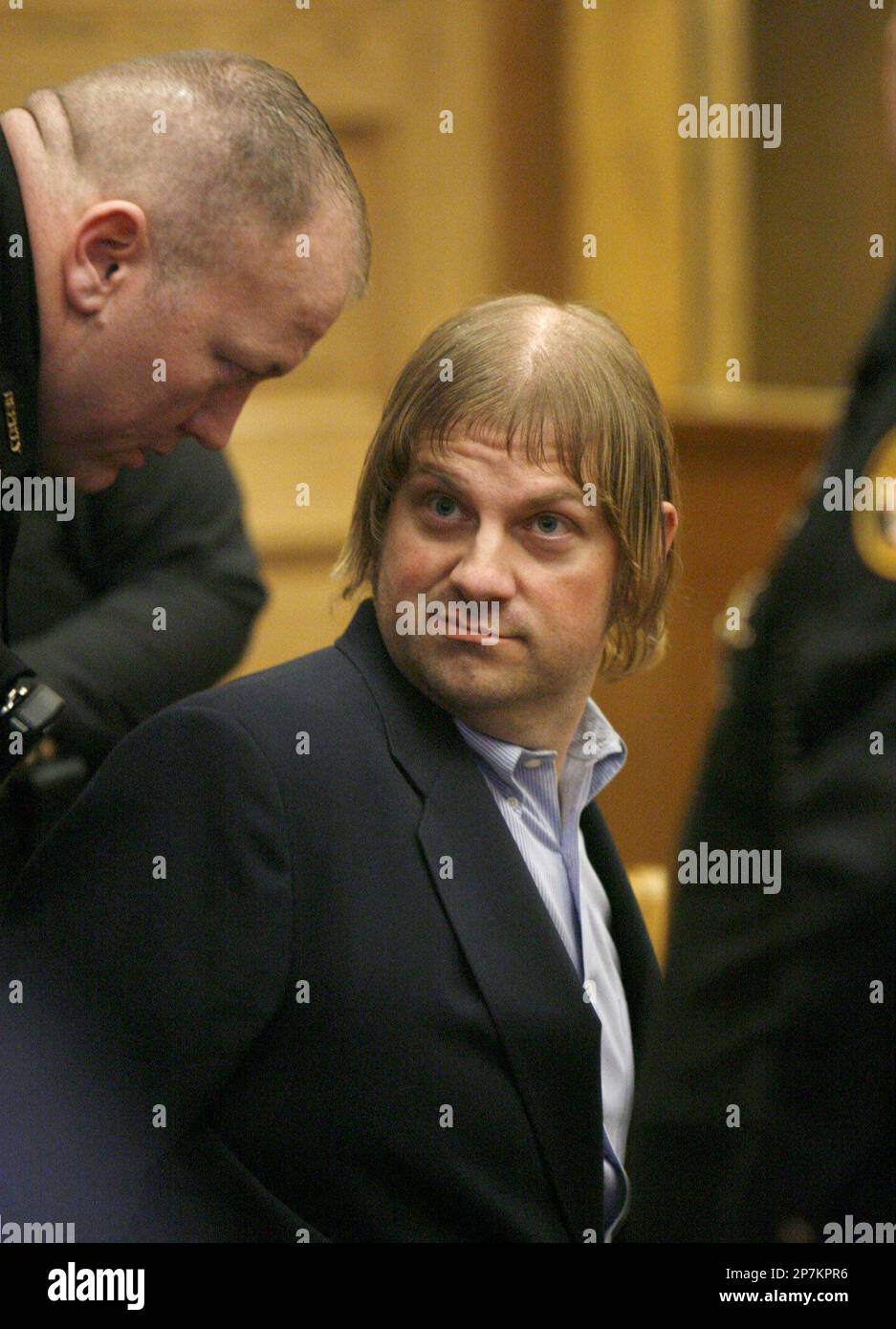 FILE- This Jan. 14, 2010 file photo shows sheriff deputy handcuffing ...