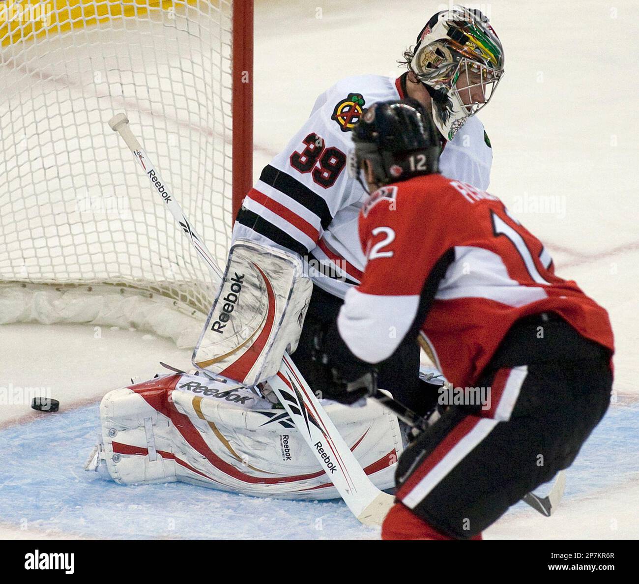 Ottawa Senators' Mike Fisher scores on Chicago Blackhawks goaltender ...