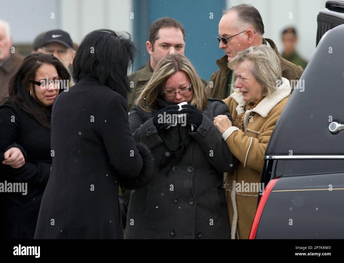 Family members visit the casket of Canadian Sgt. John Faught in the ...