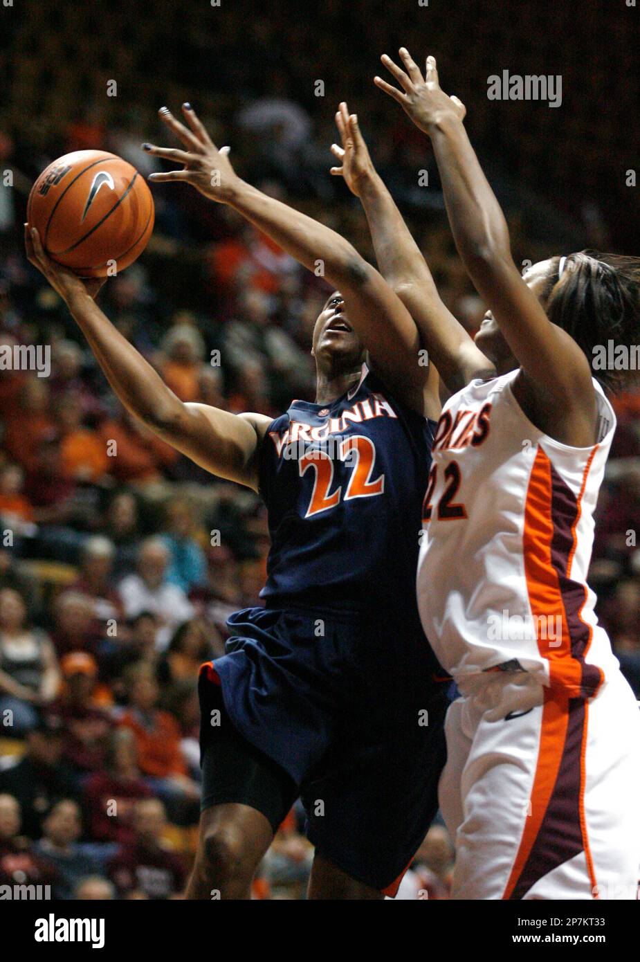 Virginia's Monica Wright, left, goes up a shot against Virginia Tech's ...
