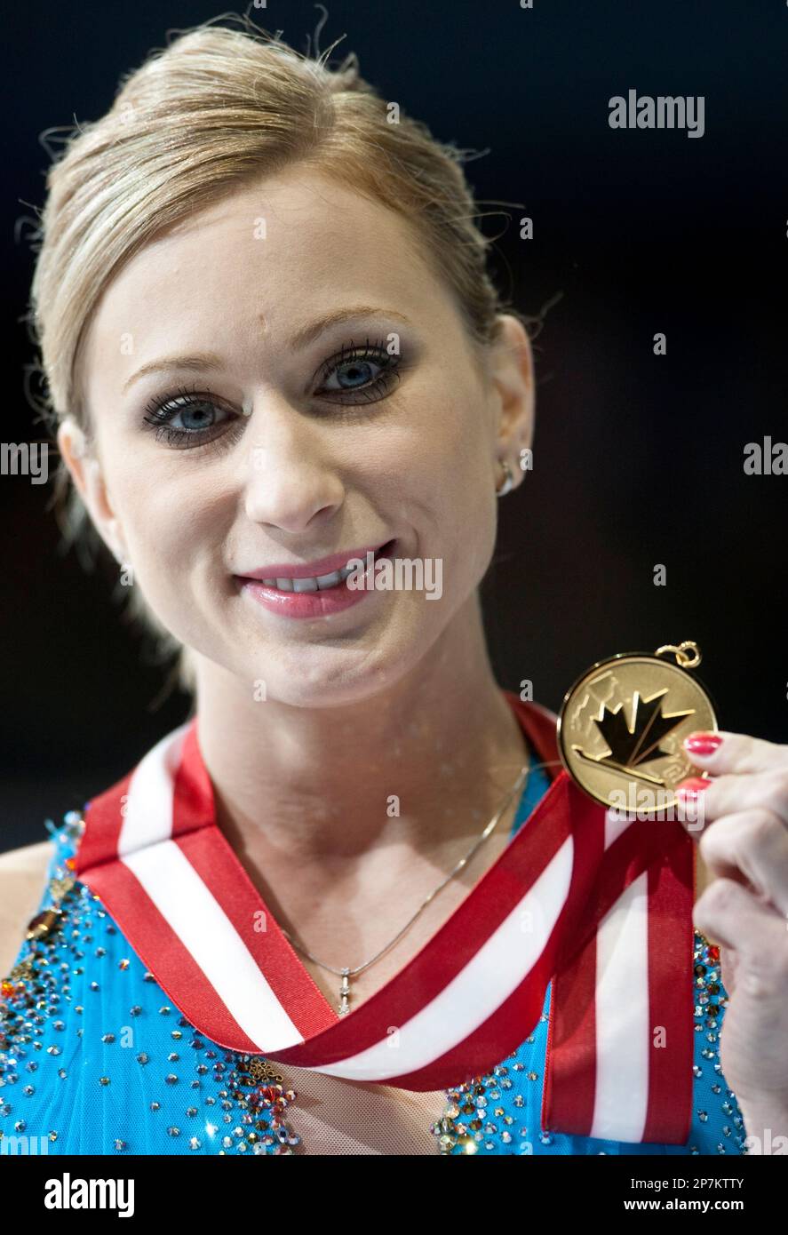 Senior women gold medalist Joannie Rochette poses with her medal during ...