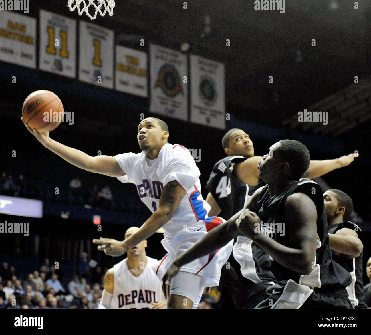 DePaul's Mike Stovall drives to the basket as Providence's Brian ...