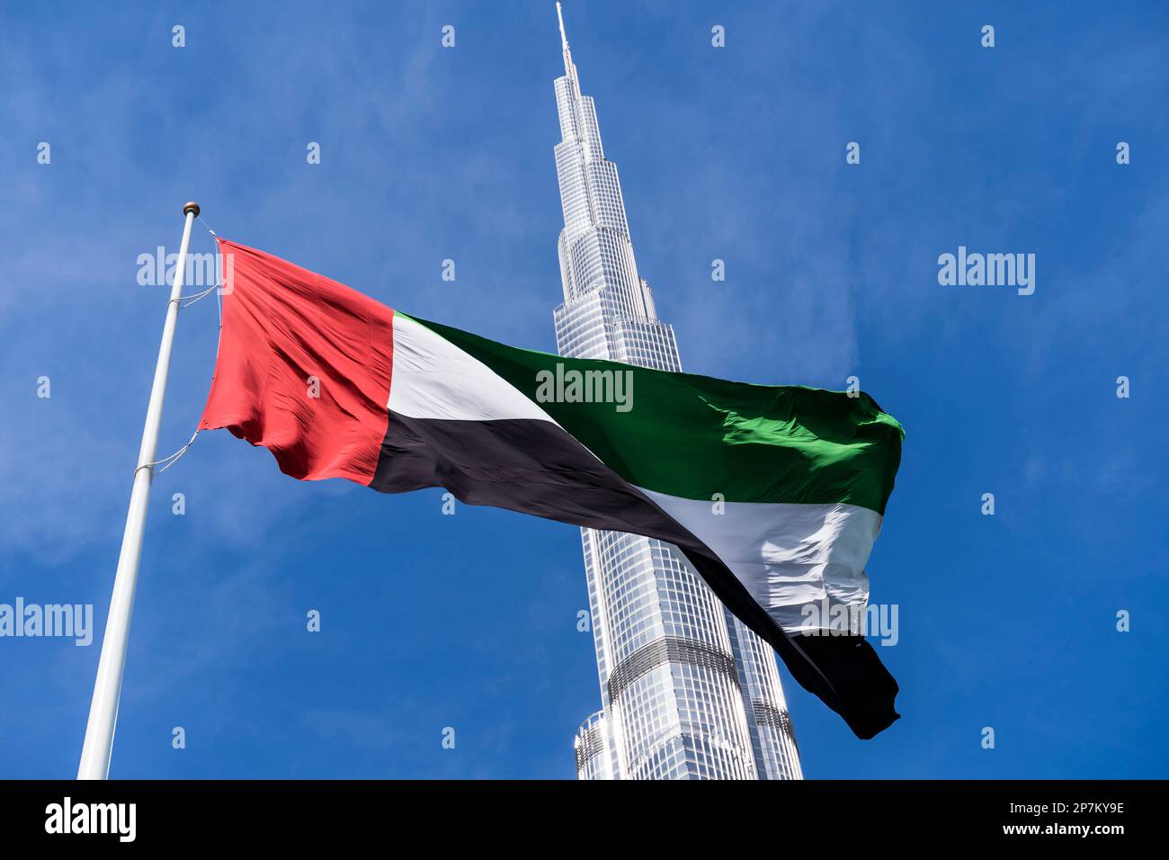 Flag of the UAE on the background of sky in Dubai. Arab Emirates ...
