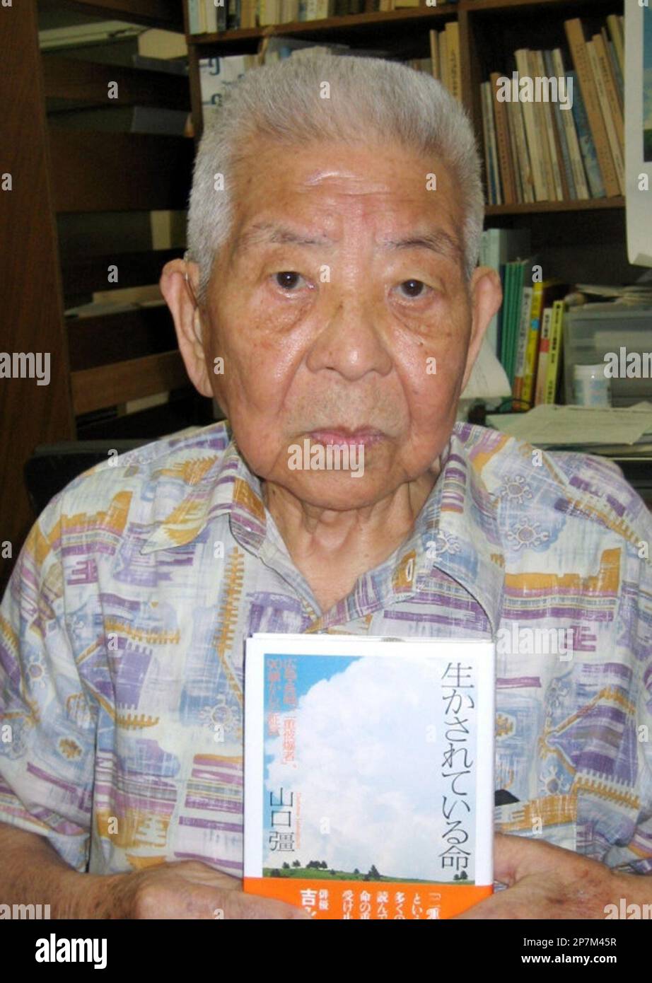 FILE - Tsutomu Yamaguchi poses during a news conference at Nagasaki ...