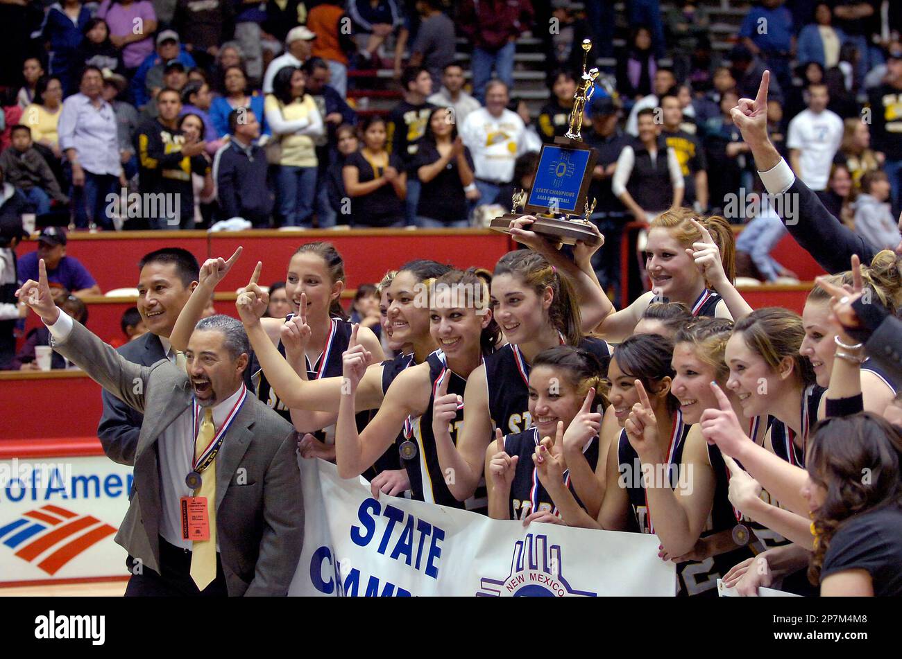 Members of the St. Pius X girls basketball team pose for a photo after ...