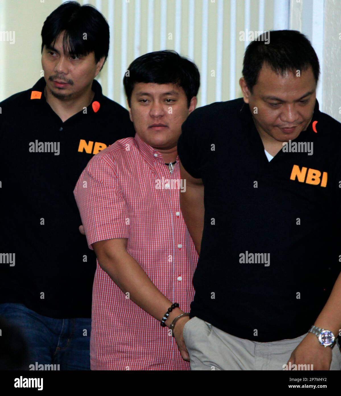 Andal Ampatuan Jr., center, the prime suspect in the massacre of 57 ...