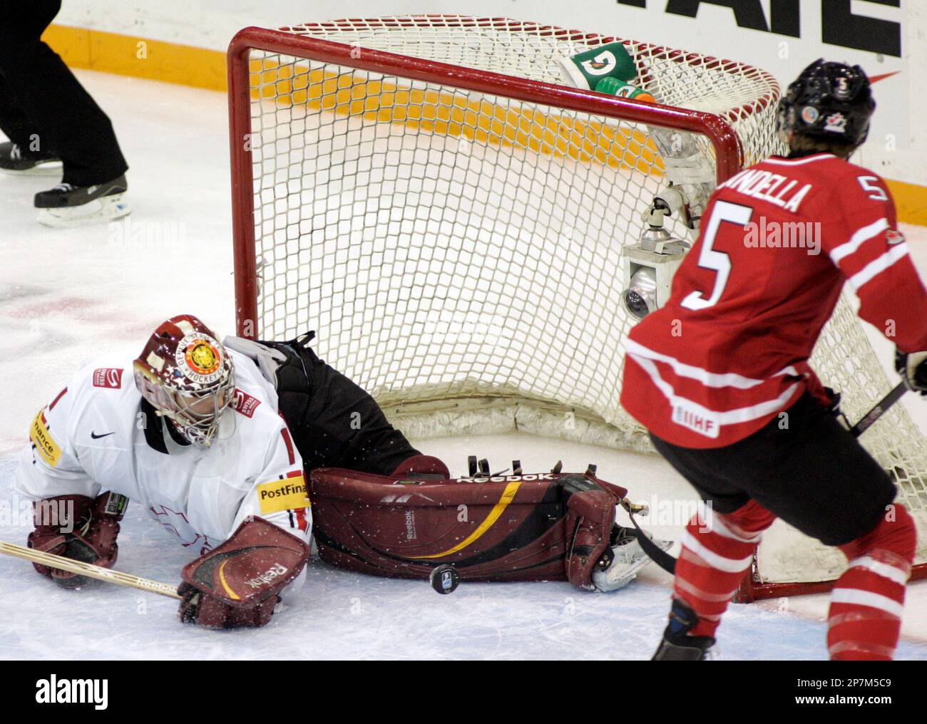 Team Canada's Marco Scandella scores on Team Switzerland goalie ...