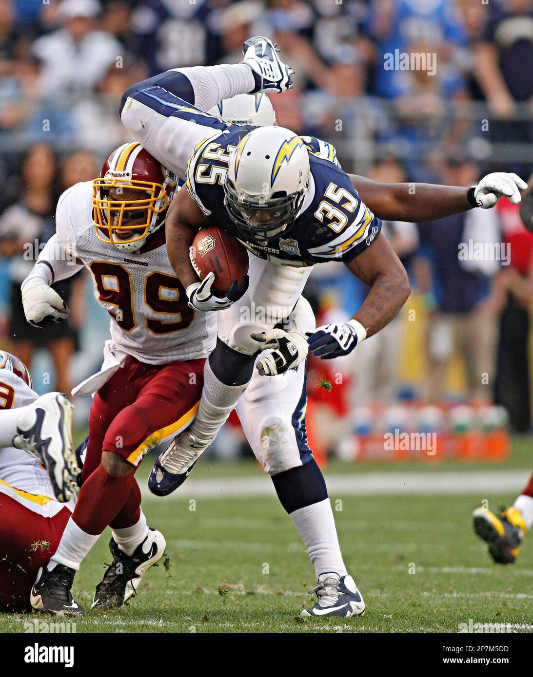 San Diego Chargers fullback Mike Tolbert (35) goes over the top of ...