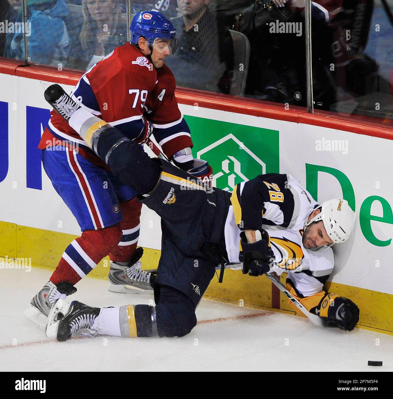 Montreal Canadiens' Roman Hamrlik, left, upends Buffalo Sabres' Paul ...
