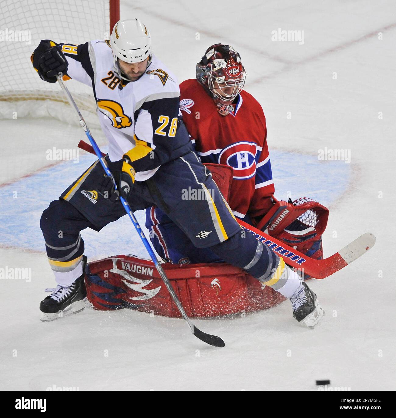 Buffalo Sabres' Paul Gaustad, left, skates in front of Montreal ...