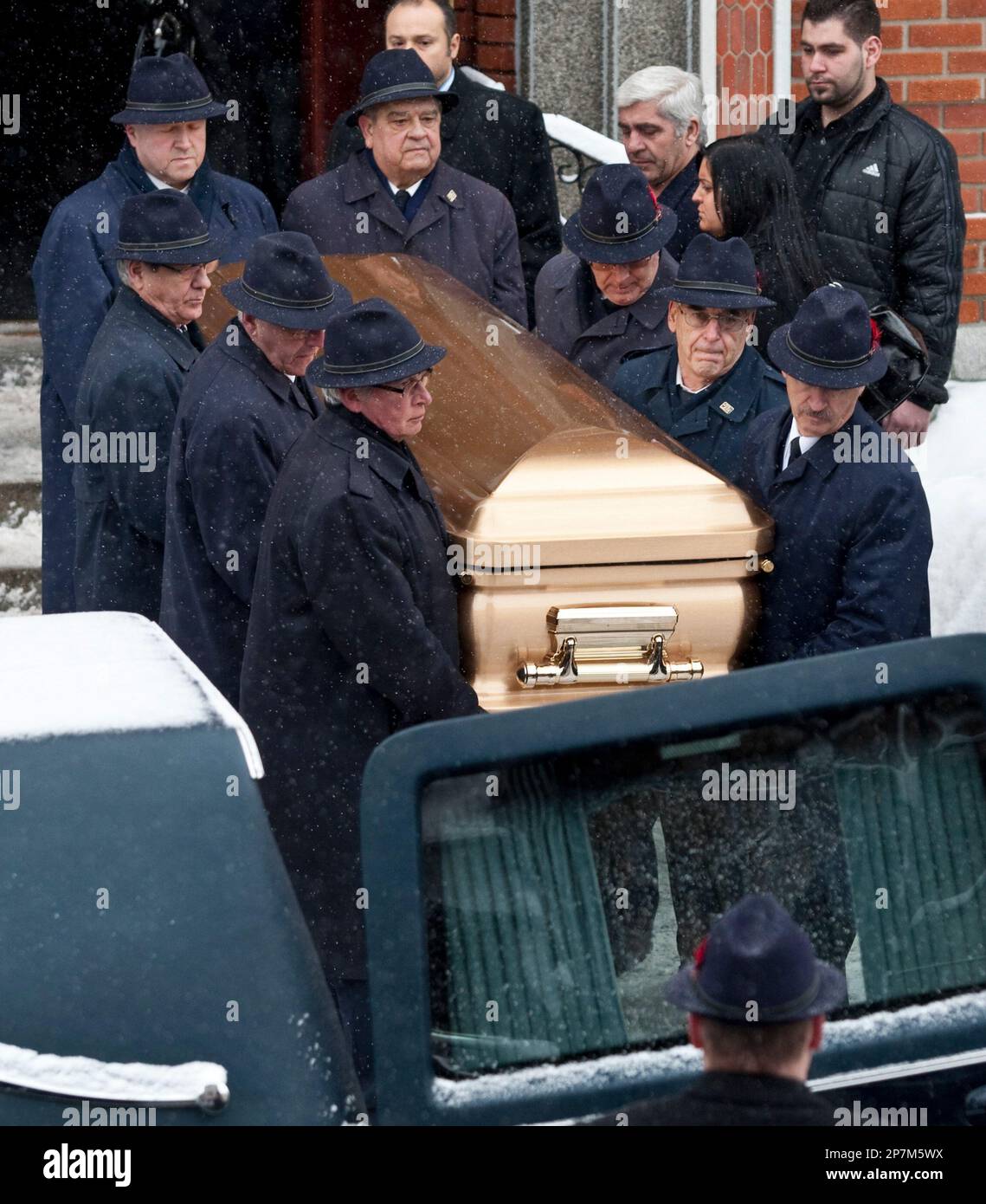 Pallbearers carry the casket containing the body of Nick Rizzuto out of ...