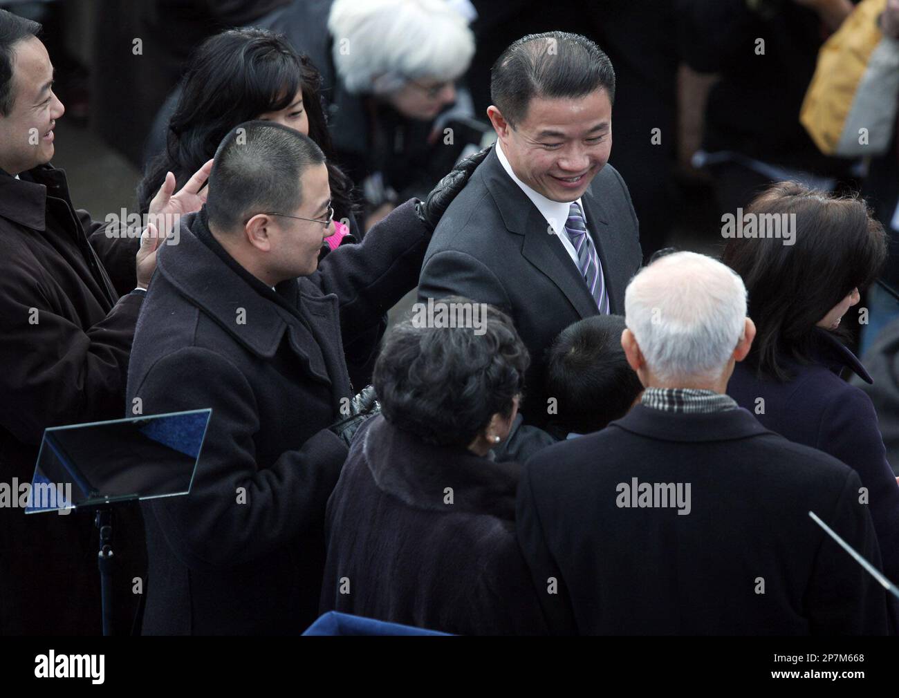 New York City Comptroller John C. Liu is congratulated by his family on ...