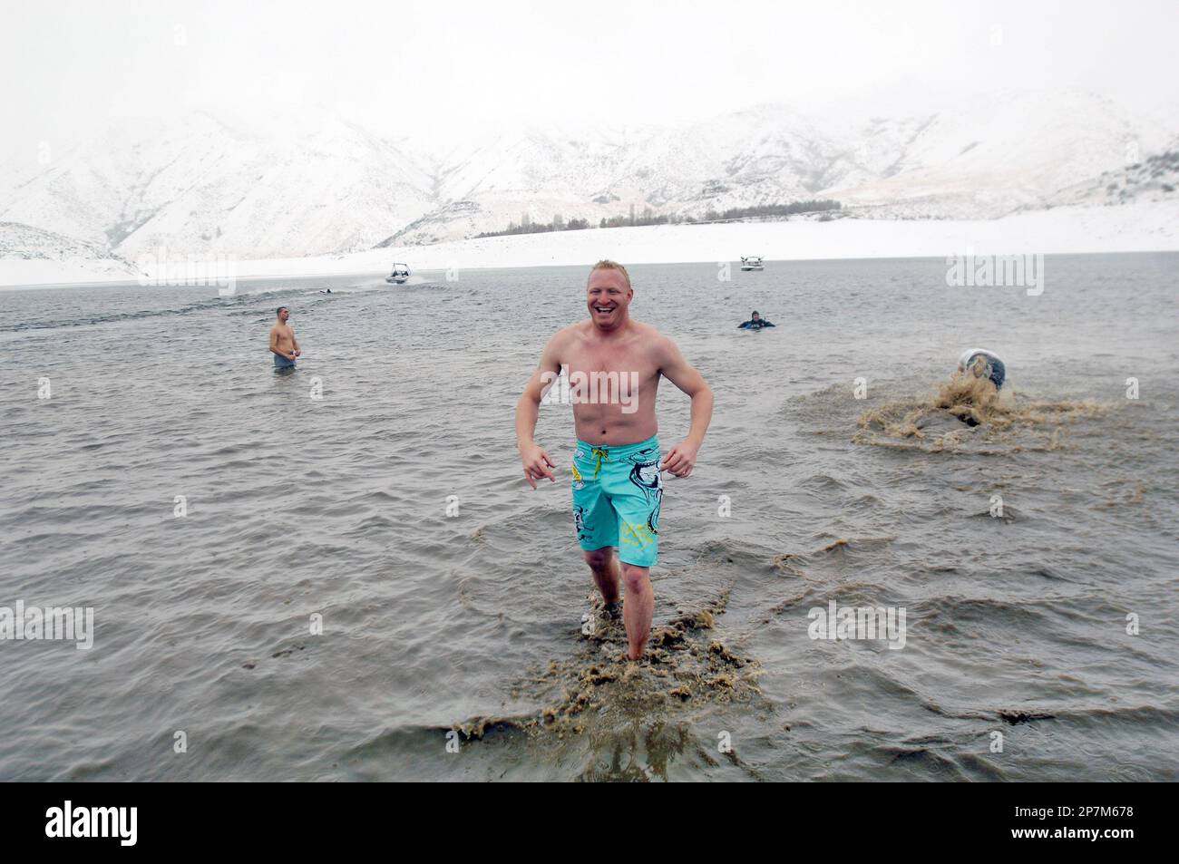 A participant in the Great Polar Bear Challenge smiles as he makes his ...