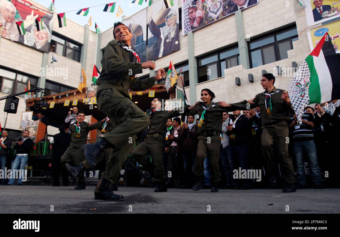 Palestinian Fatah members dance as they participate in celebrations ...