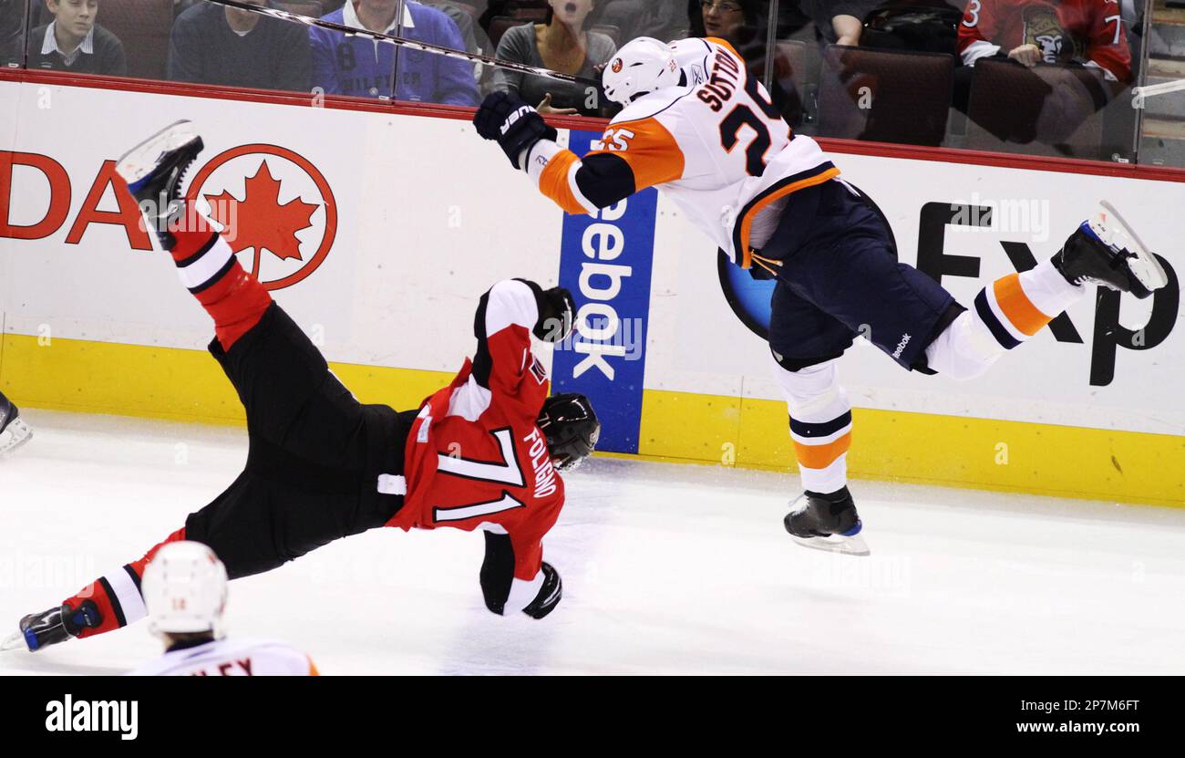 Ottawa Senators' Nick Foligno (71) collides with New York Islanders ...