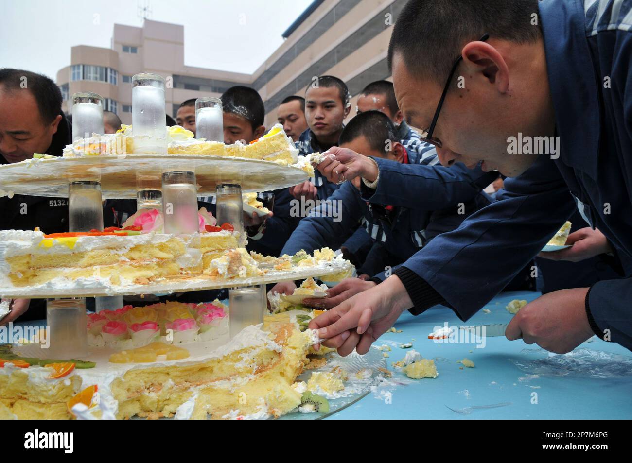 Inmates enjoy birthday cakes during a mass birthday party for inmates ...