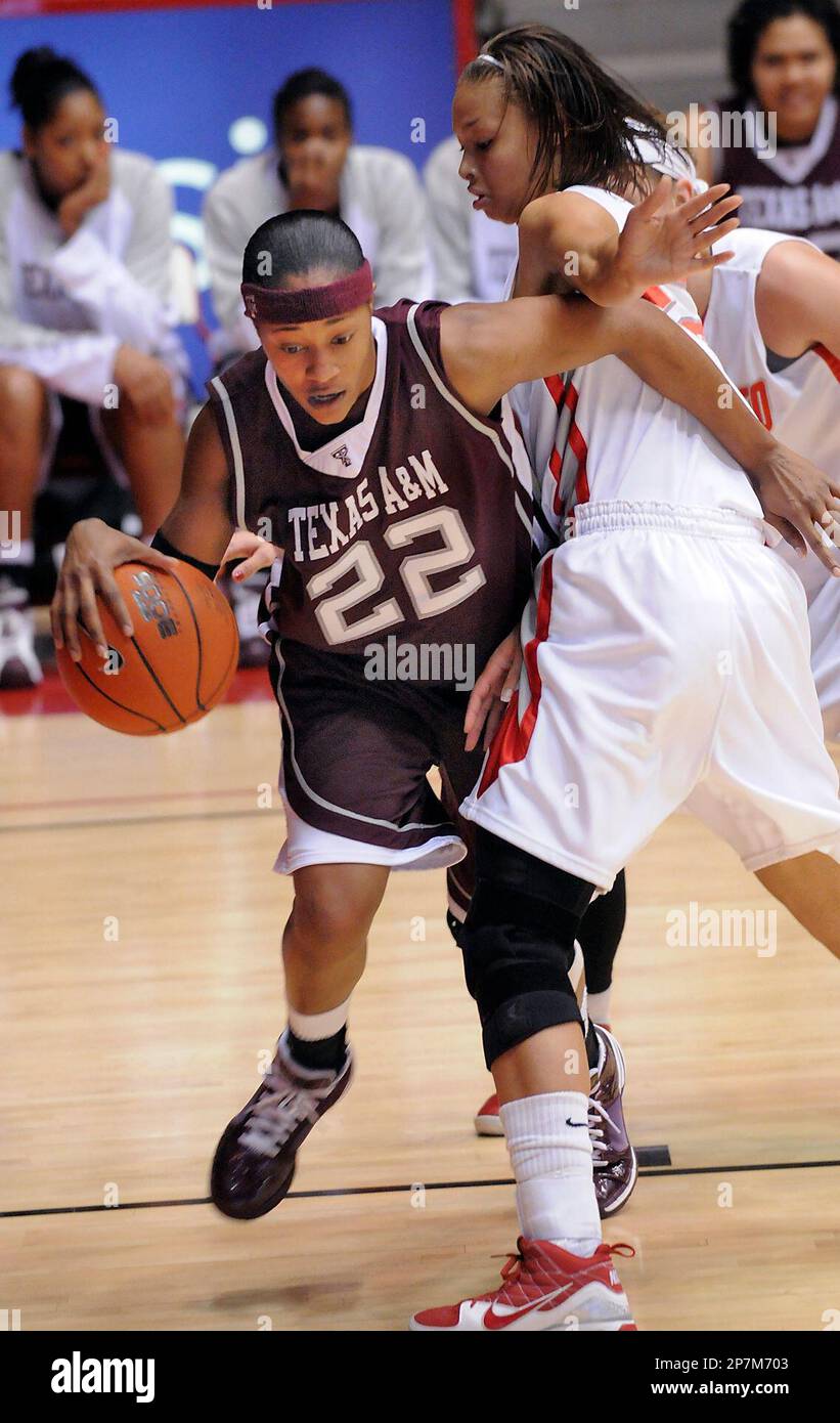 Texas A&M's Tanisha Smith, left, gets fouled by New Mexico's Georonika ...