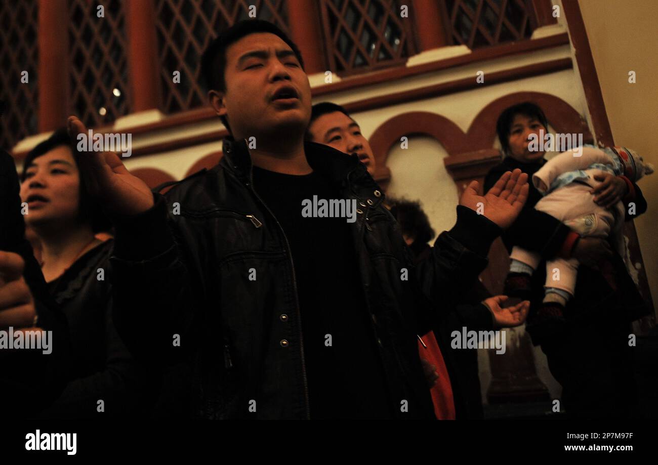 Catholic worshippers attend a Christmas mass in the Pinganqiao Catholic ...
